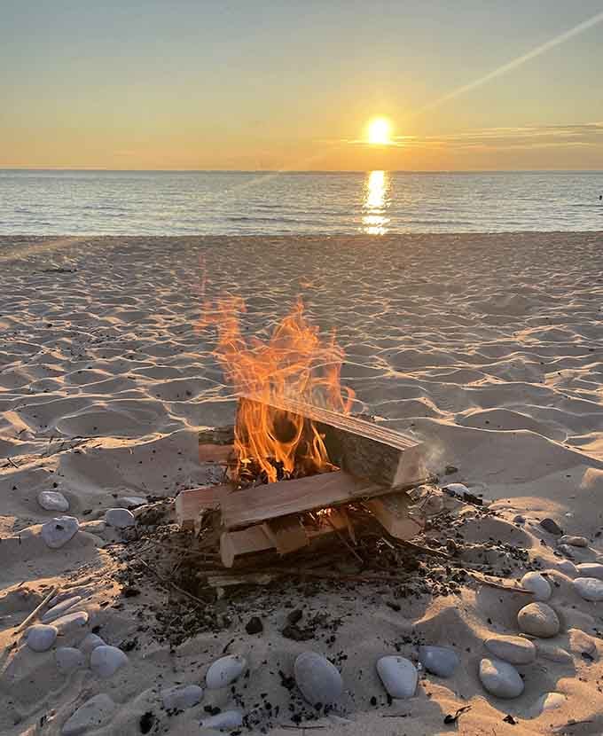 A beach bonfire at sunset is nature's way of saying you made exactly the right decision today.