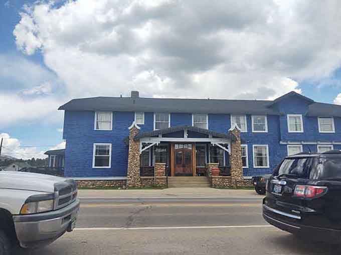 The blue hotel building sits solid and unpretentious, ready for another century of mountain hospitality.