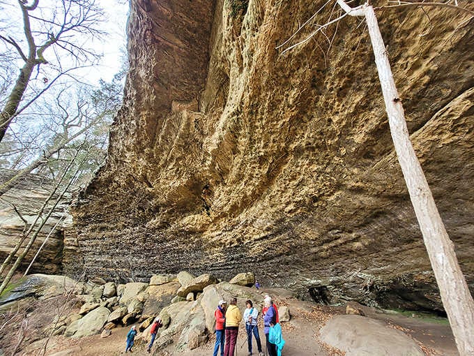 Standing beneath this towering rock shelter, you realize some places simply refuse to be ordinary or forgettable.