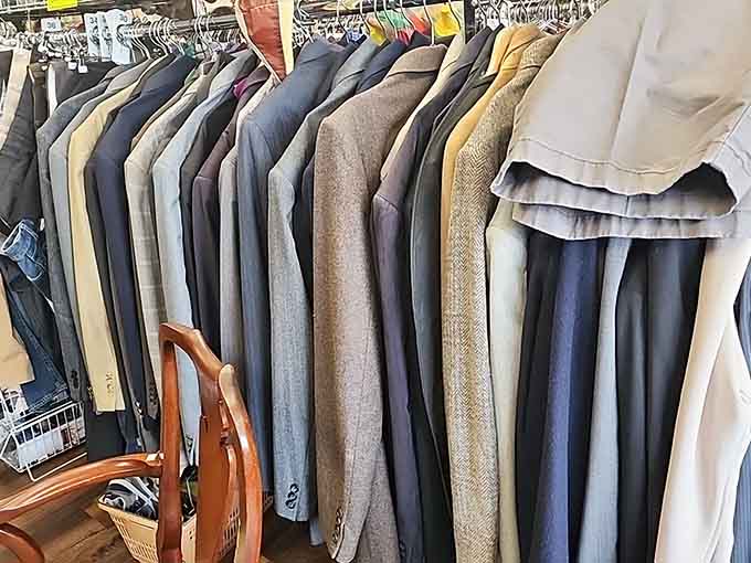 A full rail of blazers and suit jackets, neatly lined up and ready for their second act.