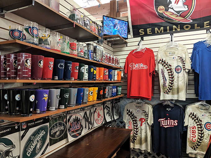 FSU flags, MLB tumblers, and team tees stacked high. Sports fans, consider this your personal trophy room.