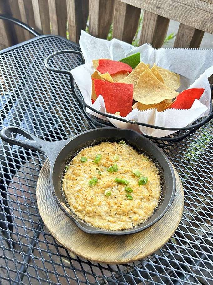 Hot crab dip arrives bubbling in a skillet, ready to start arguments over who gets the last scoop.