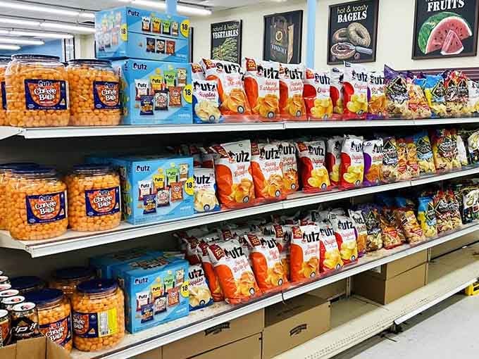 Utz cheese balls, chips, and more stacked shelf to shelf, a snack lover's version of finding buried treasure.