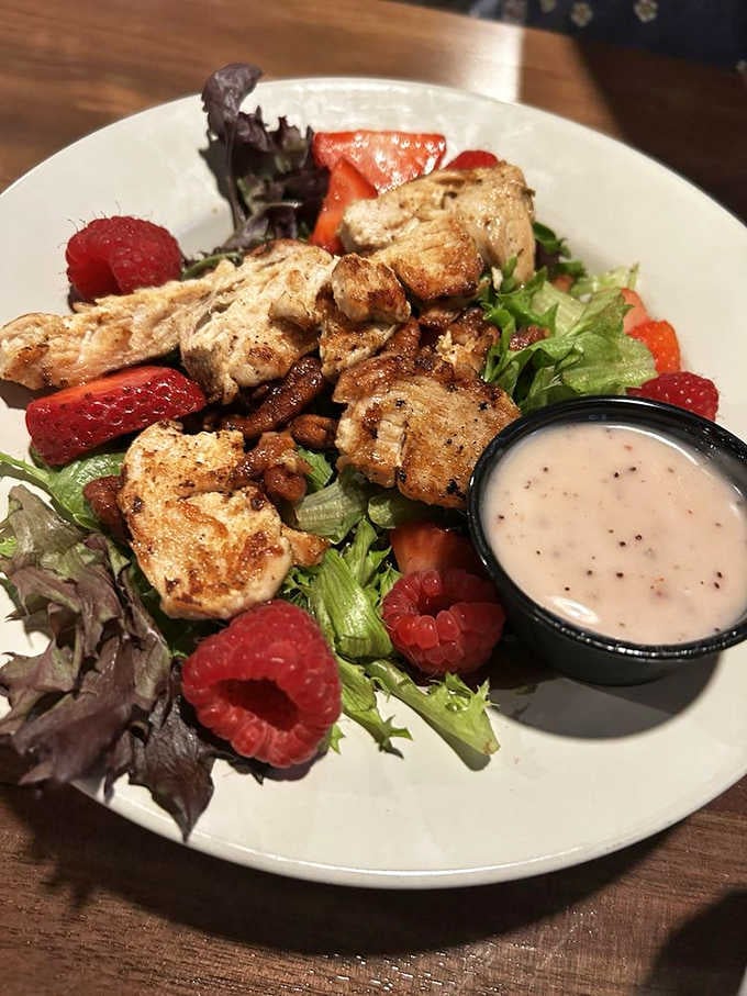 Grilled chicken, fresh raspberries, strawberries, and candied pecans on mixed greens. Proof that pub food can be genuinely gorgeous.