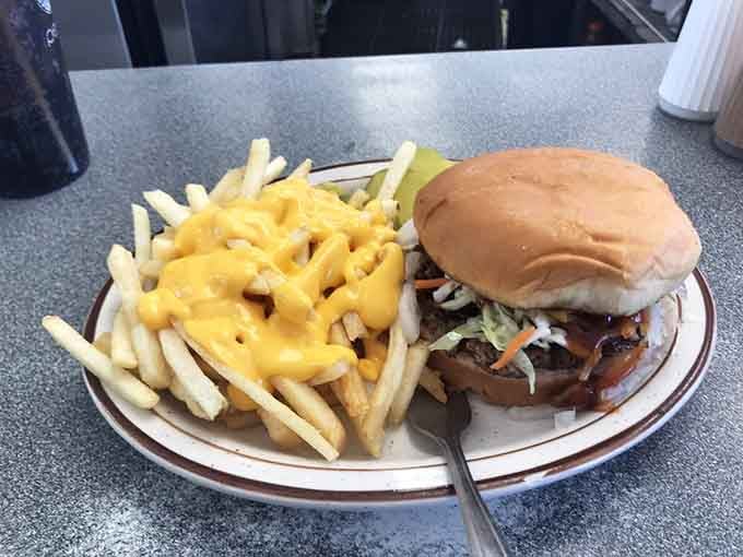 A burger with coleslaw and cheese fries on the side. Jefferson County is clearly doing something right.
