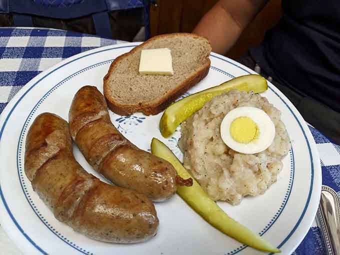 The Farmer's Brat arrives golden and pan-fried, the kind of sausage that makes you rethink lunch plans.