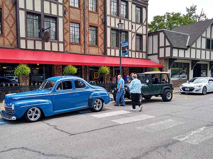 Classic cars parked outside Tudor buildings in Missouri. Nobody told Hollister it couldn't have it all.