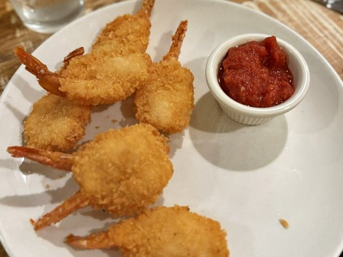 Lightly breaded gulf shrimp with cocktail sauce, proof that Hollyhock Hill knows its way around more than just chicken.