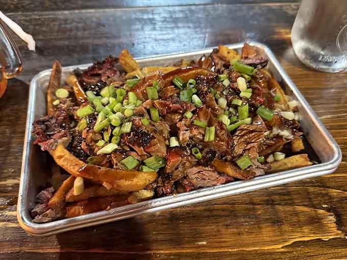 Hand-cut fries buried under brisket debris and gravy. Texas poutine is the crossover nobody asked for but everyone needs.
