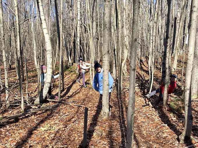 Kids in the woods, maps in hand, zero screens in sight. This is what a good Saturday looks like.