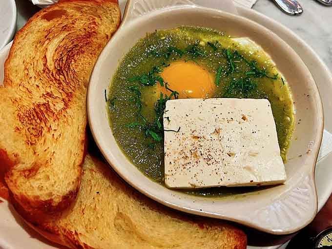 Green shakshuka with feta and a perfectly poached egg. One bite and you'll rethink everything about breakfast.