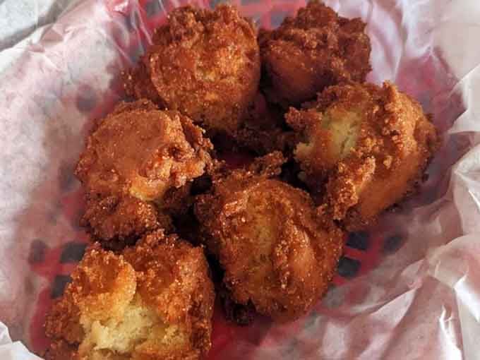 Hush puppies so perfectly golden and round, they deserve their own standing ovation right now.