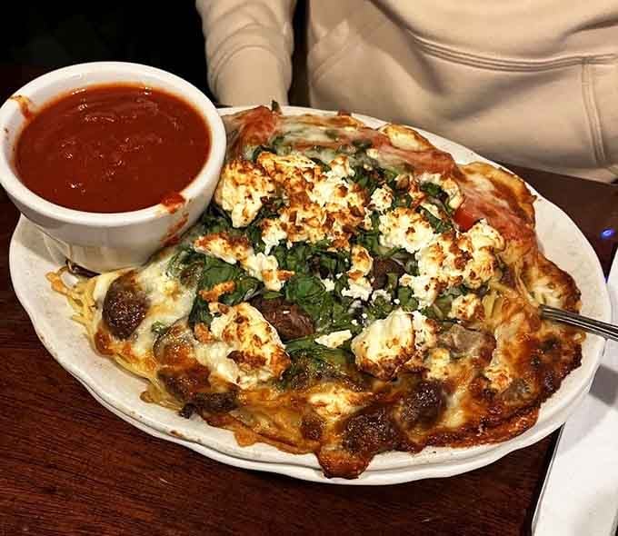 Spaghetti A La Rudd, topped with spinach, feta, and meatballs. Comfort food with a little extra personality.