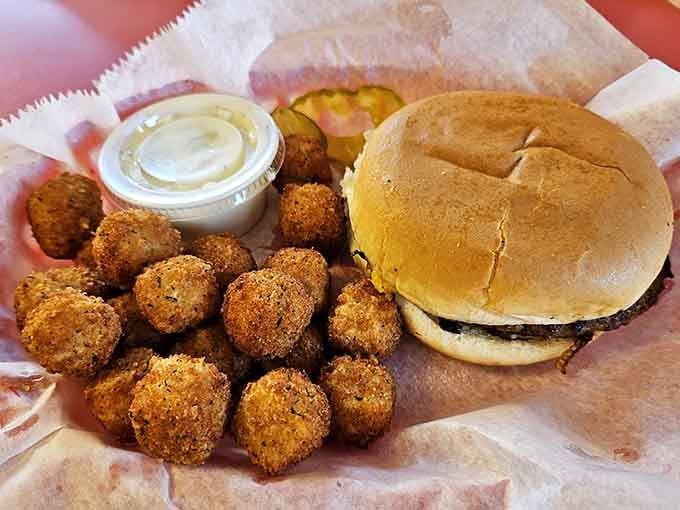 Fried okra and a burger sharing a basket, proving that Missouri knows how to do comfort food right.