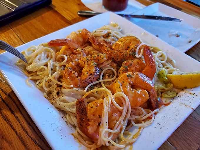 Cajun-spiced shrimp piled high over pasta. This dish doesn't whisper, it announces itself with confidence.