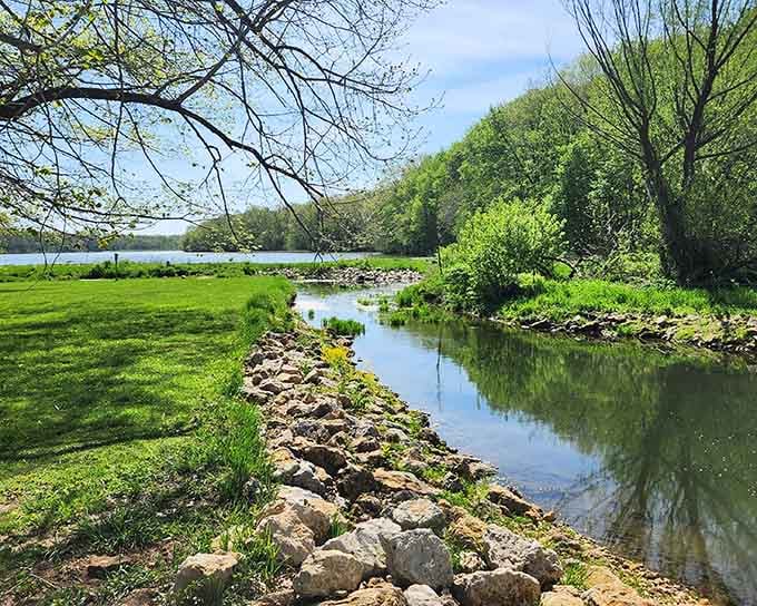 A stone-lined channel leading your eye straight toward the open lake, spring has never looked this effortlessly inviting.