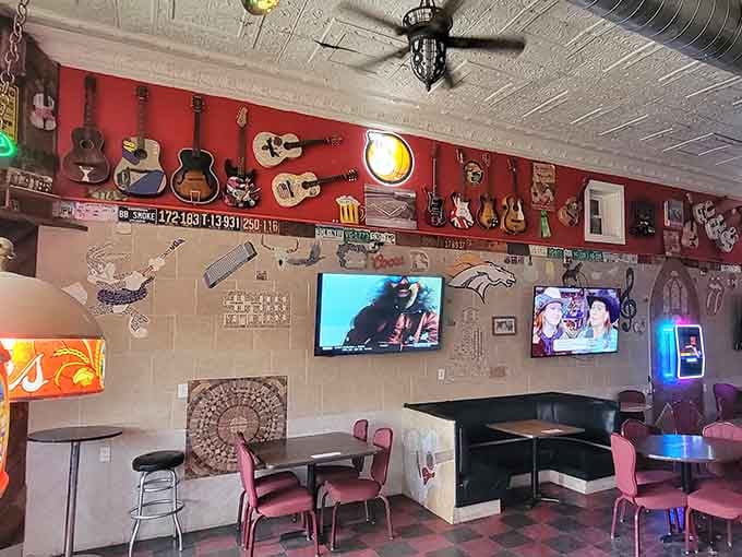 The Buzzards Roost's walls are covered in guitars and license plates. Every inch tells a story.