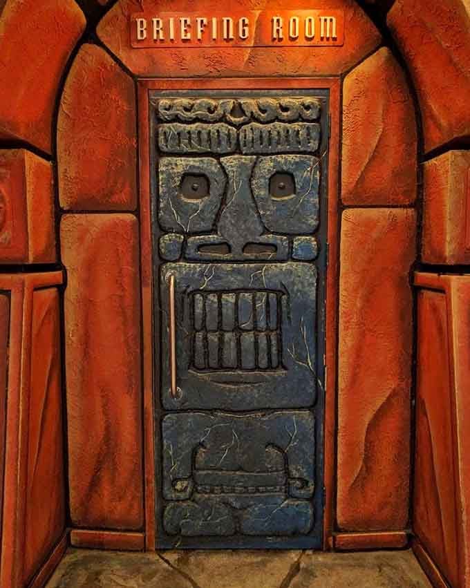 That ancient stone-carved Briefing Room door is basically the universe's way of saying, "Your mission starts right here."