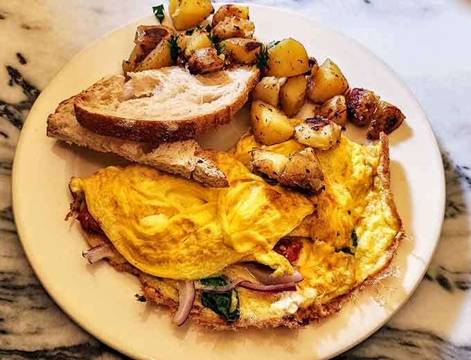 That omelet-to-potato ratio is exactly what your morning needs, plus toast for good measure because carbs are friends.