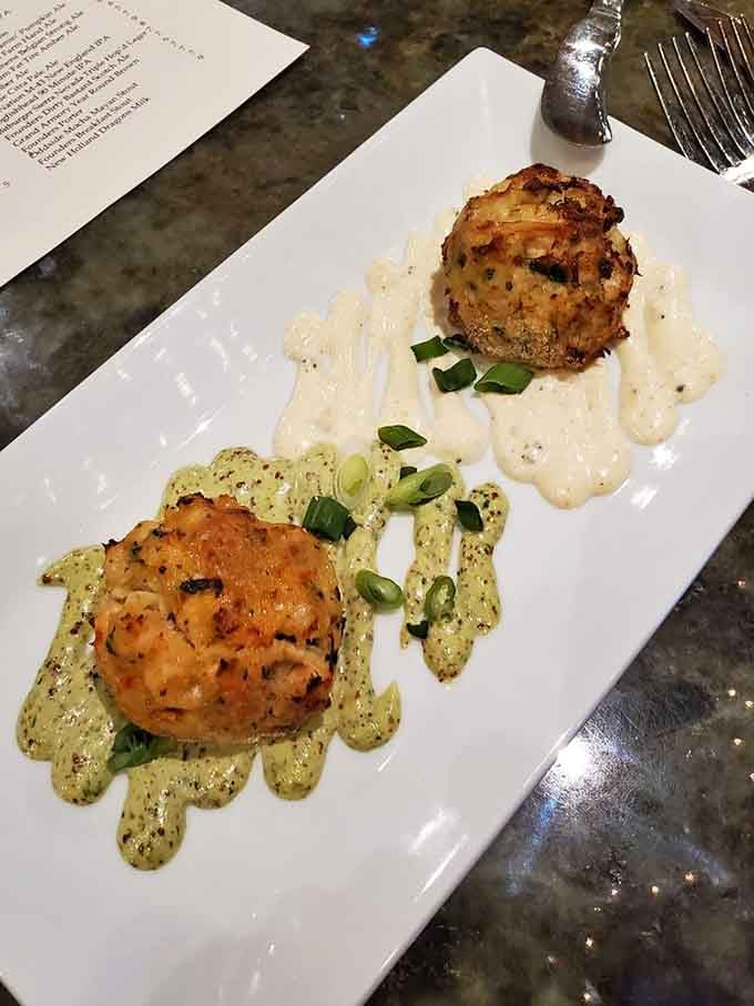 Side by side, the crab cake and lobster-shrimp cake look like they're competing for your affection.