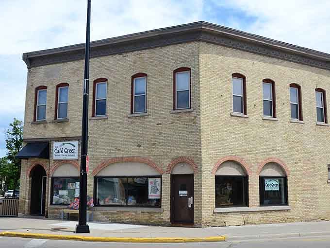 Café Green tucks itself into a sturdy cream-brick corner building, the kind of spot that looks like it has a really good soup of the day.