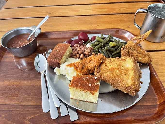 Crispy fried chicken drowning in gravy alongside green beans and cornbread will make your taste buds declare independence.