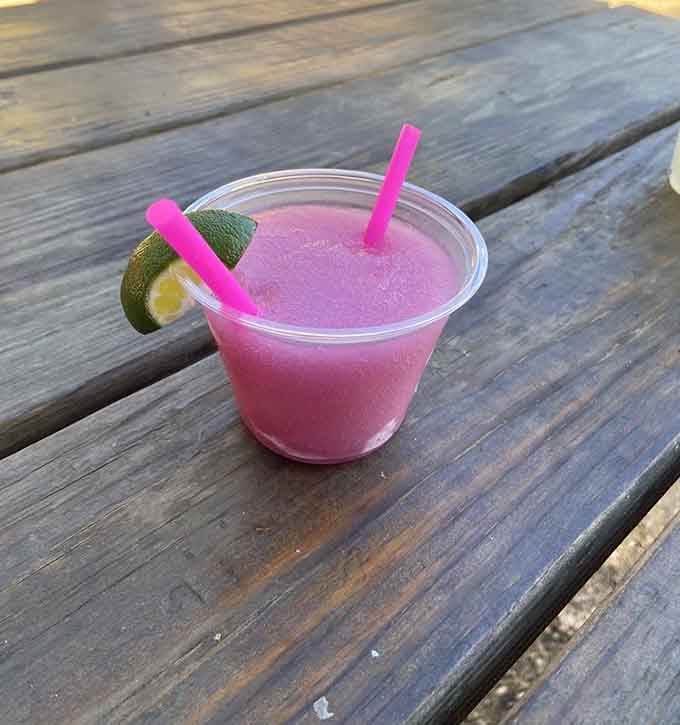 A frozen margarita with lime is the perfect cooling companion when you're eating barbecue under the Texas sun.