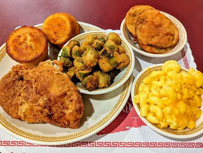 Fried chicken, fried okra, fried green tomatoes, and cornbread. A tray so Southern it practically hums Lynyrd Skynyrd.