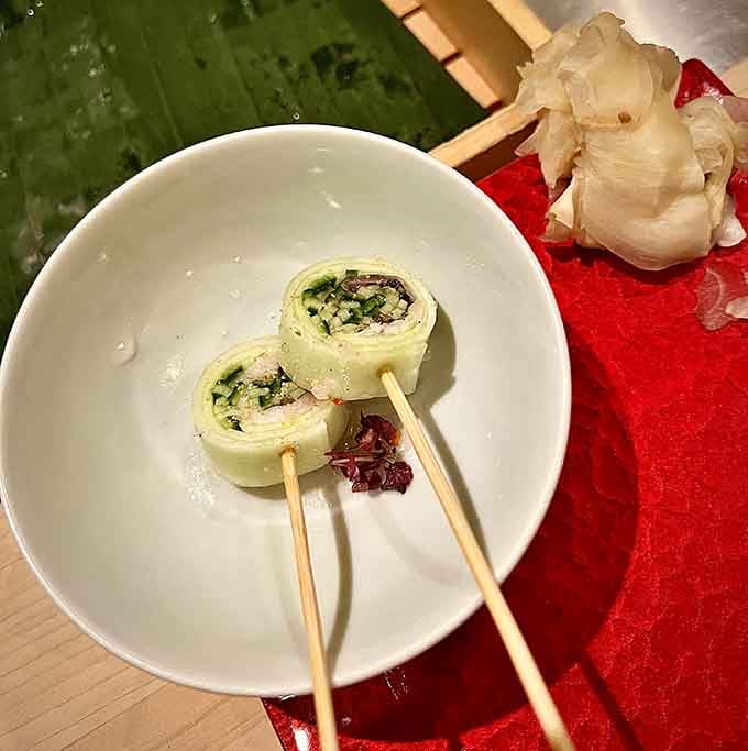Two neat rolls skewered on bamboo, fresh and precise, looking almost too composed to disturb, but you absolutely should.