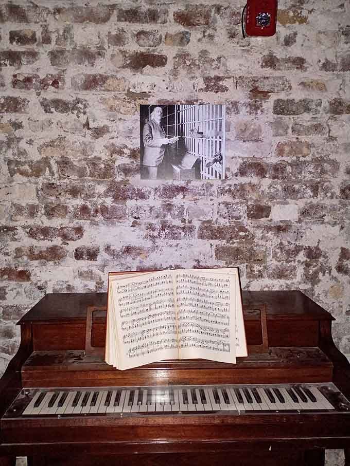Nobody expected a piano inside a haunted jail. Yet here it sits, sheet music and all.