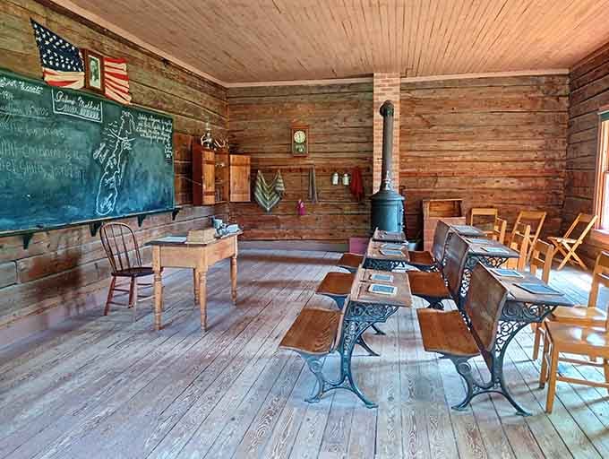 Rows of wooden desks and a chalkboard wall remind you that school was serious business long before smartphones existed.