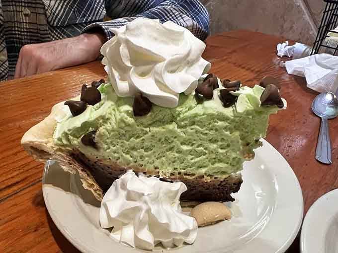 Pistachio cream pie with chocolate chips and whipped cream. Green has never looked this dangerously good.