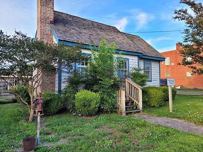 This little blue-trimmed cottage has seen more history than most buildings three times its size and twice its attitude.