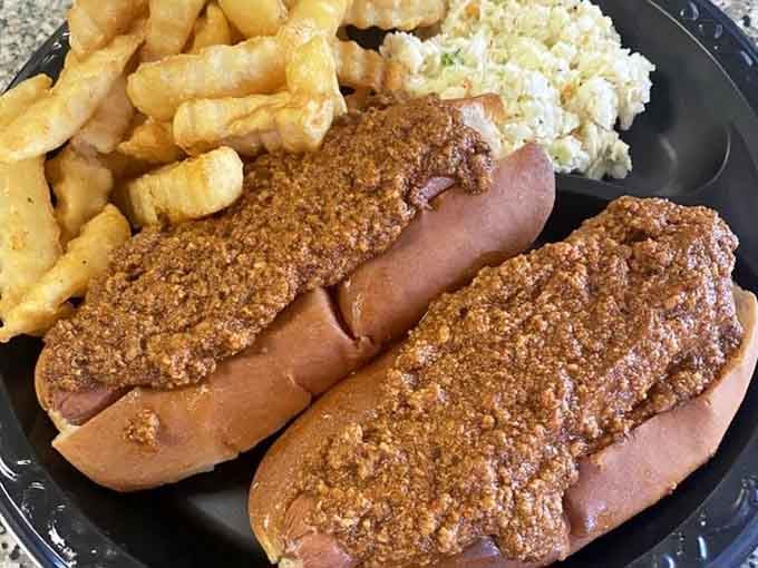 Two chili dogs arrive loaded and ready. This is comfort food that doesn't apologize for anything.