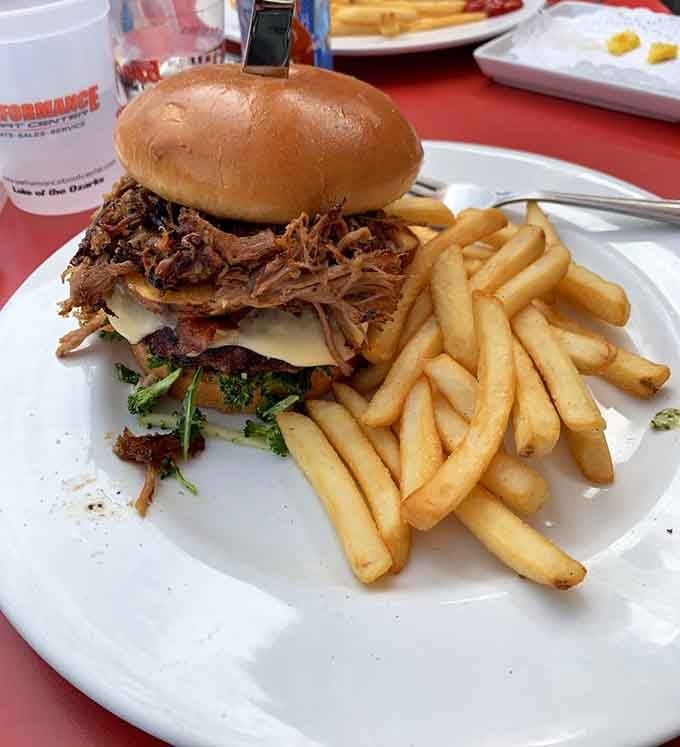 That pulled pork sandwich is stacked so high it requires both hands and your full attention.