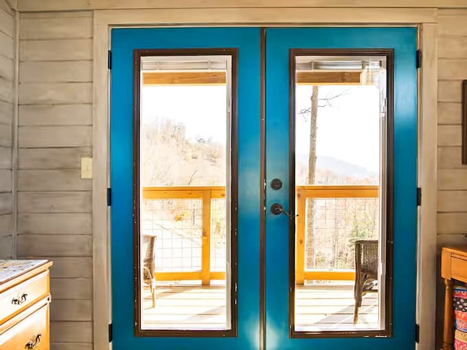 Those teal French doors aren't just pretty. They're your personal gateway to the Blue Ridge Mountains.