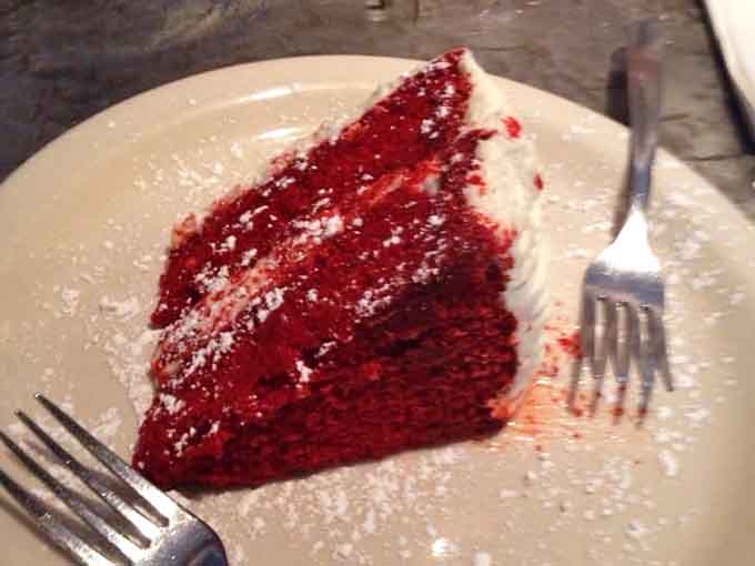 Red velvet cake layers so vibrant and moist, they redefine what dessert is supposed to accomplish.