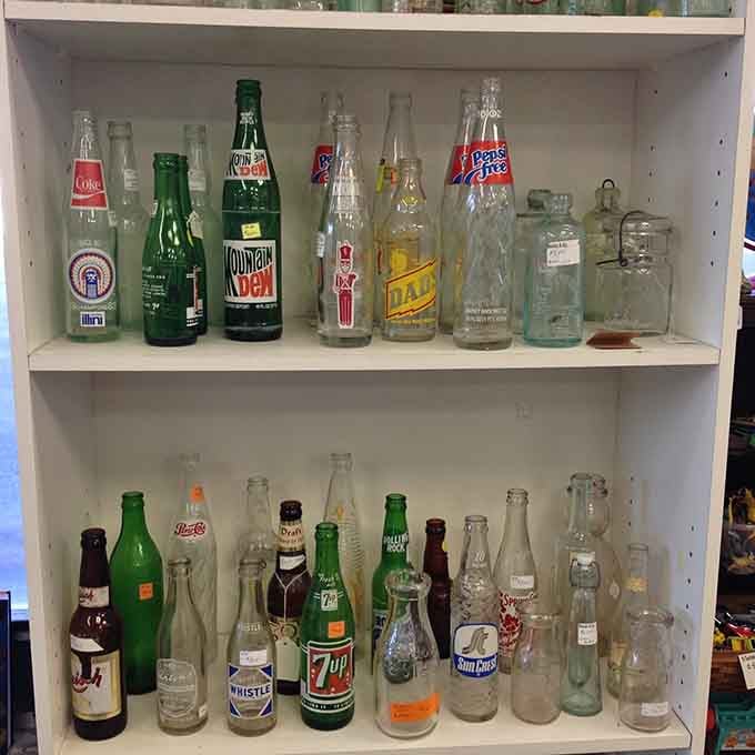Vintage soda bottles line up like soldiers from America's fizzy past, each one a little time capsule of refreshment.