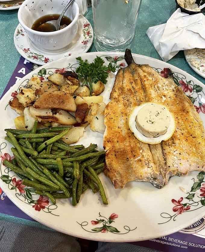 A beautifully prepared fish dish with green beans and golden home fries. Simple, honest cooking done with real care and skill.