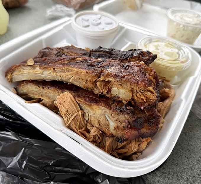 Those ribs aren't just food, they're a love letter written in smoke, fire, and serious pit-cooking dedication.
