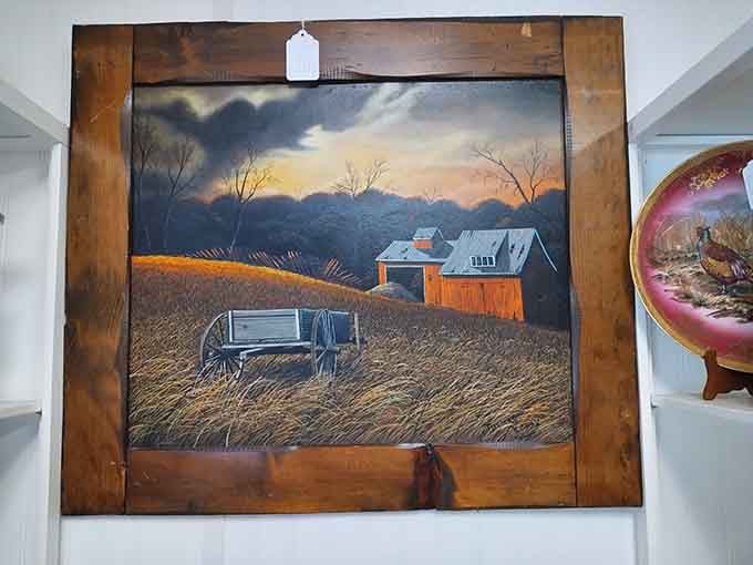 A moody oil painting of a barn at dusk, framed in rustic wood and absolutely ready for your wall.