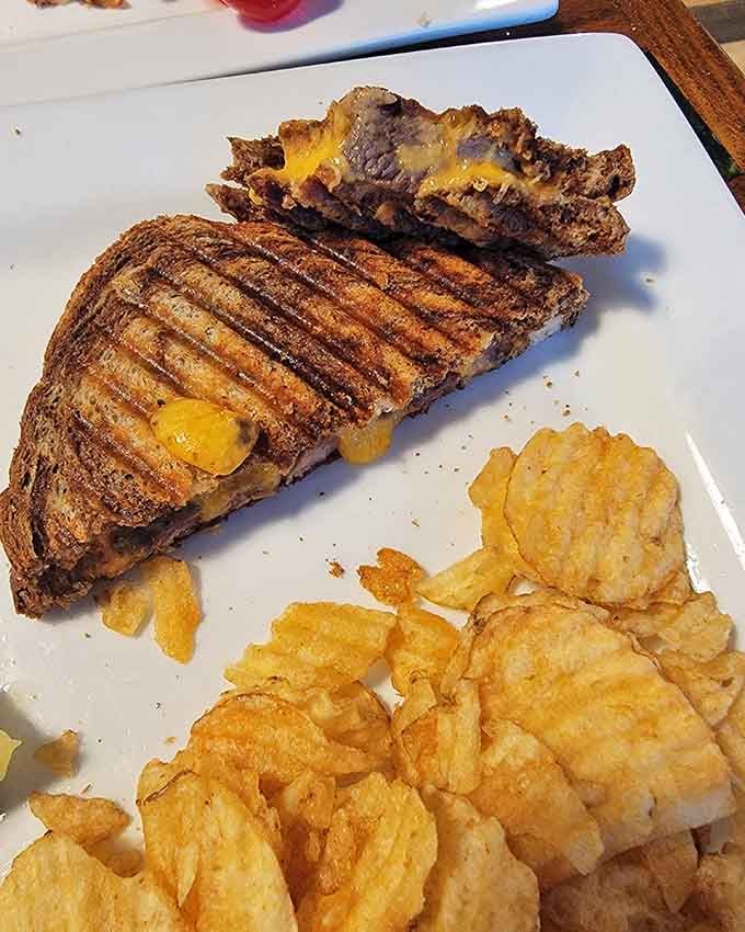 The Eddie's Melt delivers melted cheese and hearty filling between perfectly grilled bread with satisfying crunch.