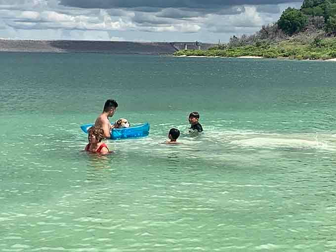 Crystal-clear water so gorgeous the family dog scored a private float, and honestly, who can blame him?