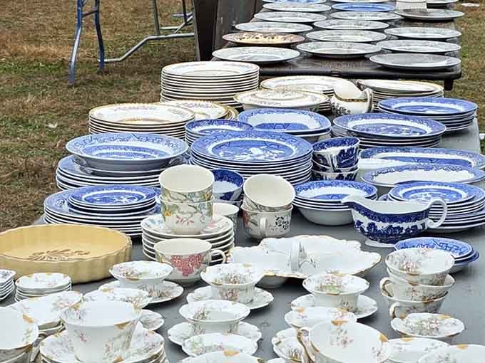 Stacks of blue willow china and floral teacups, because your grandmother's table deserves a proper reunion tour.