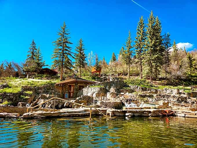 Perched on the hillside, the whole scene unfolds below you like a postcard that somehow smells like pine and warm minerals.