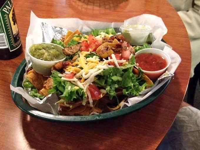 Shrimp and chicken nachos loaded so generously, you'll need a game plan before the first bite.