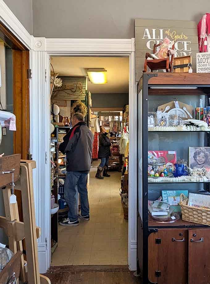 Shoppers moving room to room at The Big White House, each doorway revealing something completely unexpected.