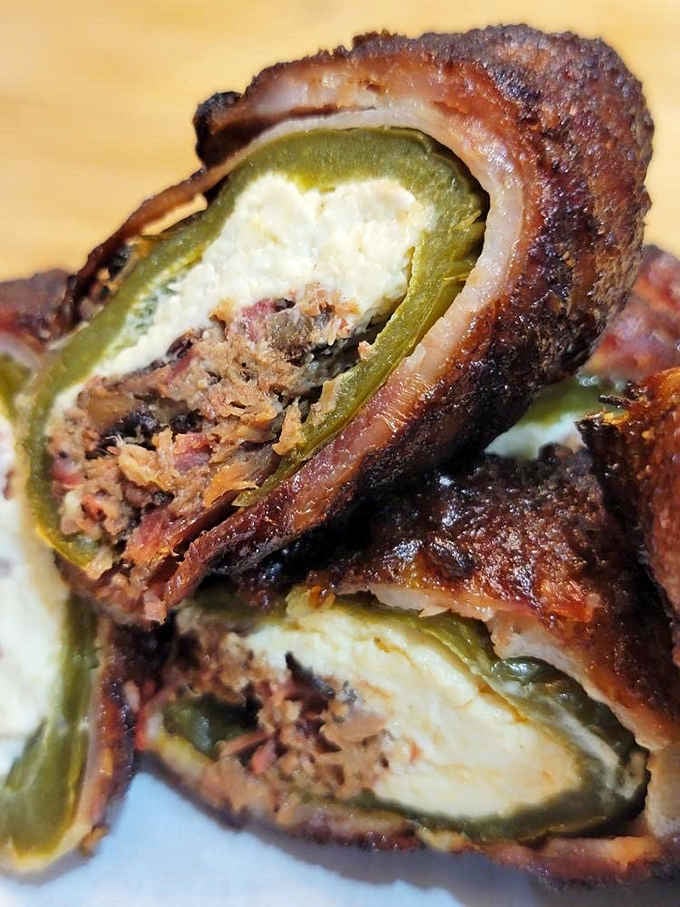 Cut one open and the whole room stops. Brisket, cream cheese, jalapeño, bacon. Pure smoky perfection.