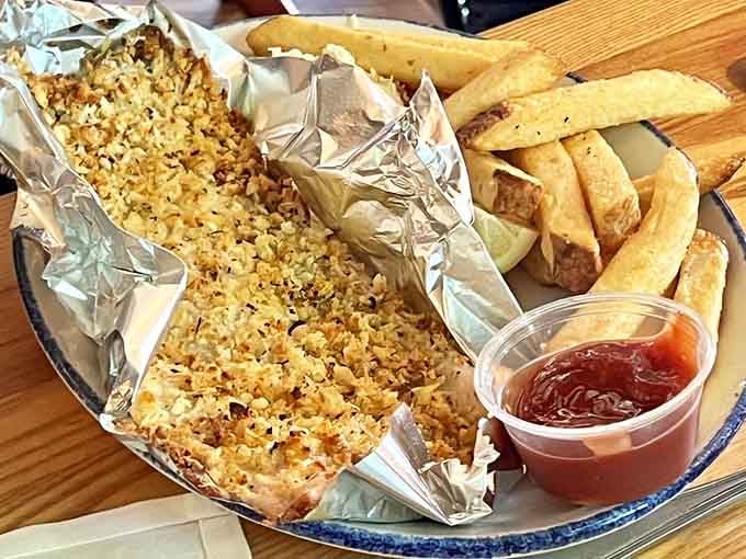Parmesan-crusted whitefish glistening in foil looks like someone wrapped up a little piece of heaven.