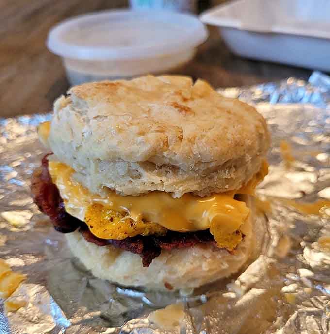 This breakfast sandwich stacked with egg, sausage, and cheese is basically morning perfection between two biscuits.
